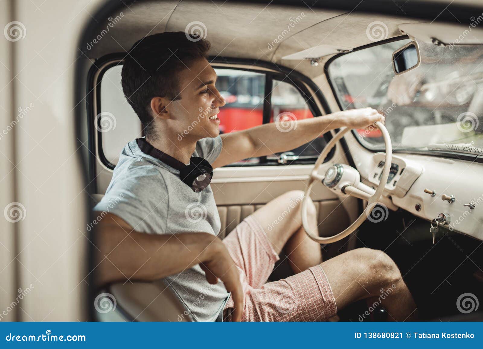 A Young and Attractive Man is Driving a Vintage Car Stock Image - Image ... A Young and Attractive Man is Driving a Vintage Car Stock Image - Image ...