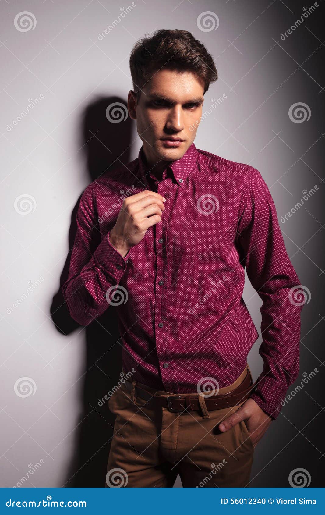 Young Attractive Man Fixing His Collar. Stock Photo - Image of hands ...