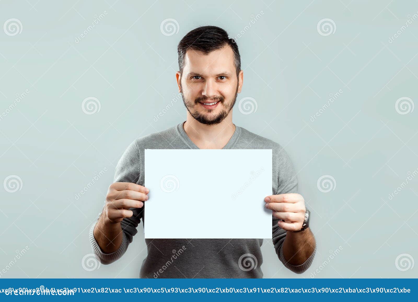A Young, Attractive Man Holding a Blank White A4 Sheet, on a Light ...