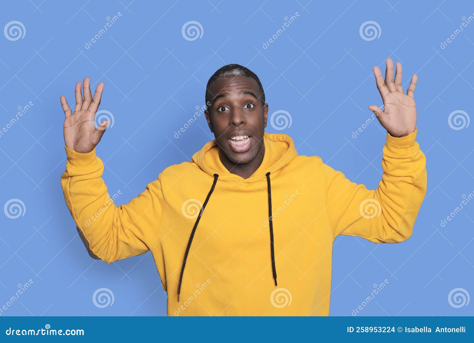A Young Attractive Man Looking Surprised Isolated on Blue Background ...