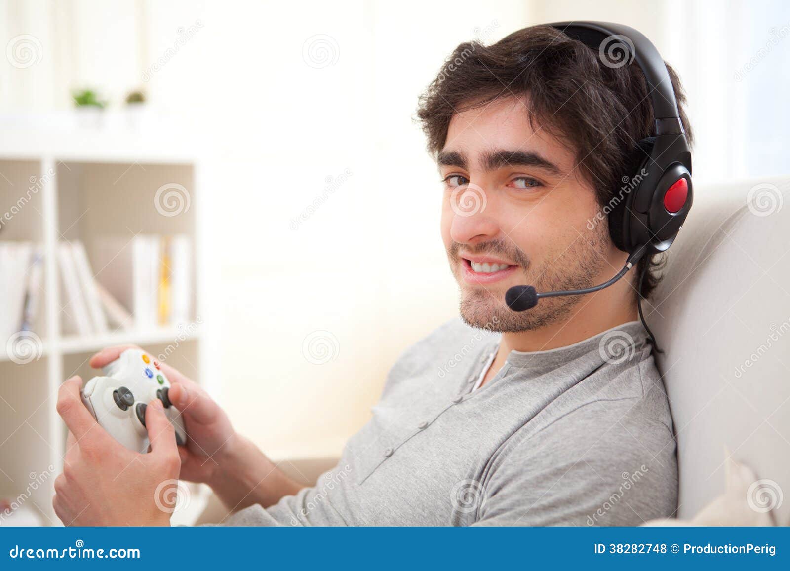Young Attractive Man Playing Video Games in a Sofa Stock Photo - Image ...