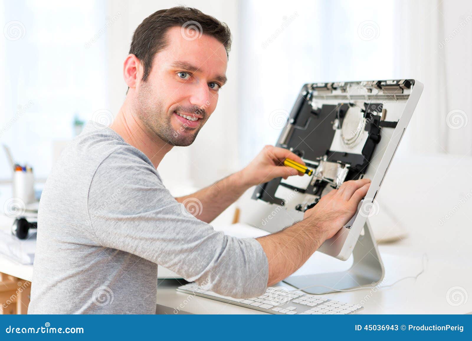Young Attractive Man Repairing a Computer Stock Image - Image of parts ...