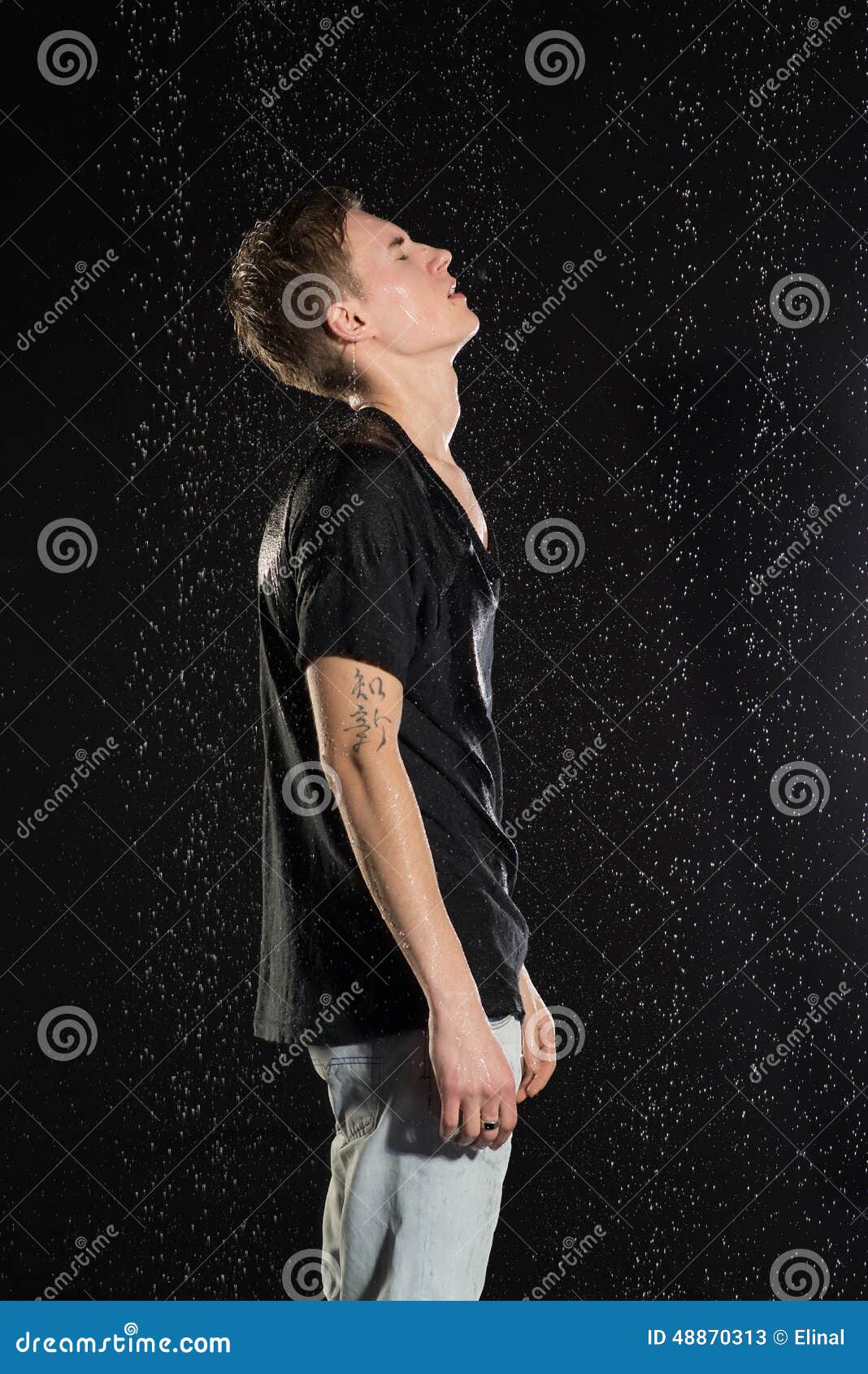 Young Attractive Man Standing Under Rain in Jeans and Tshirt Stock ...