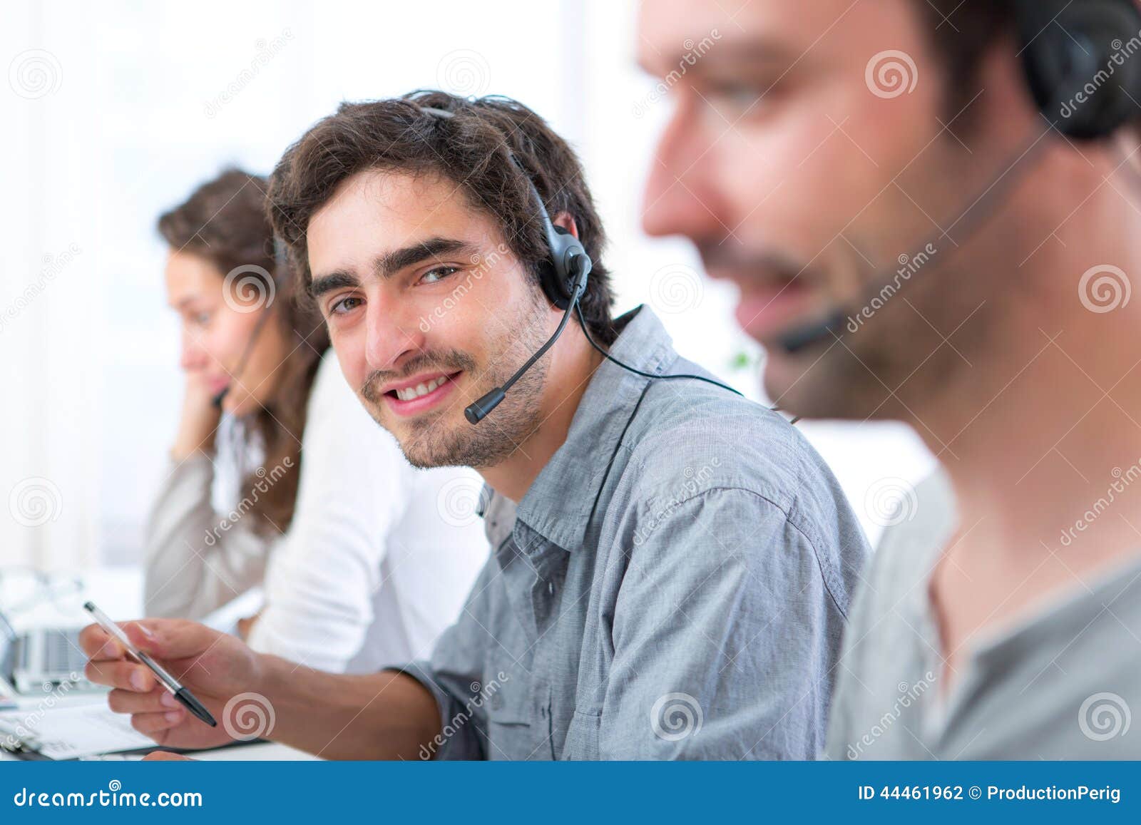 Young Attractive Man Working in a Call Center Stock Photo - Image of ...