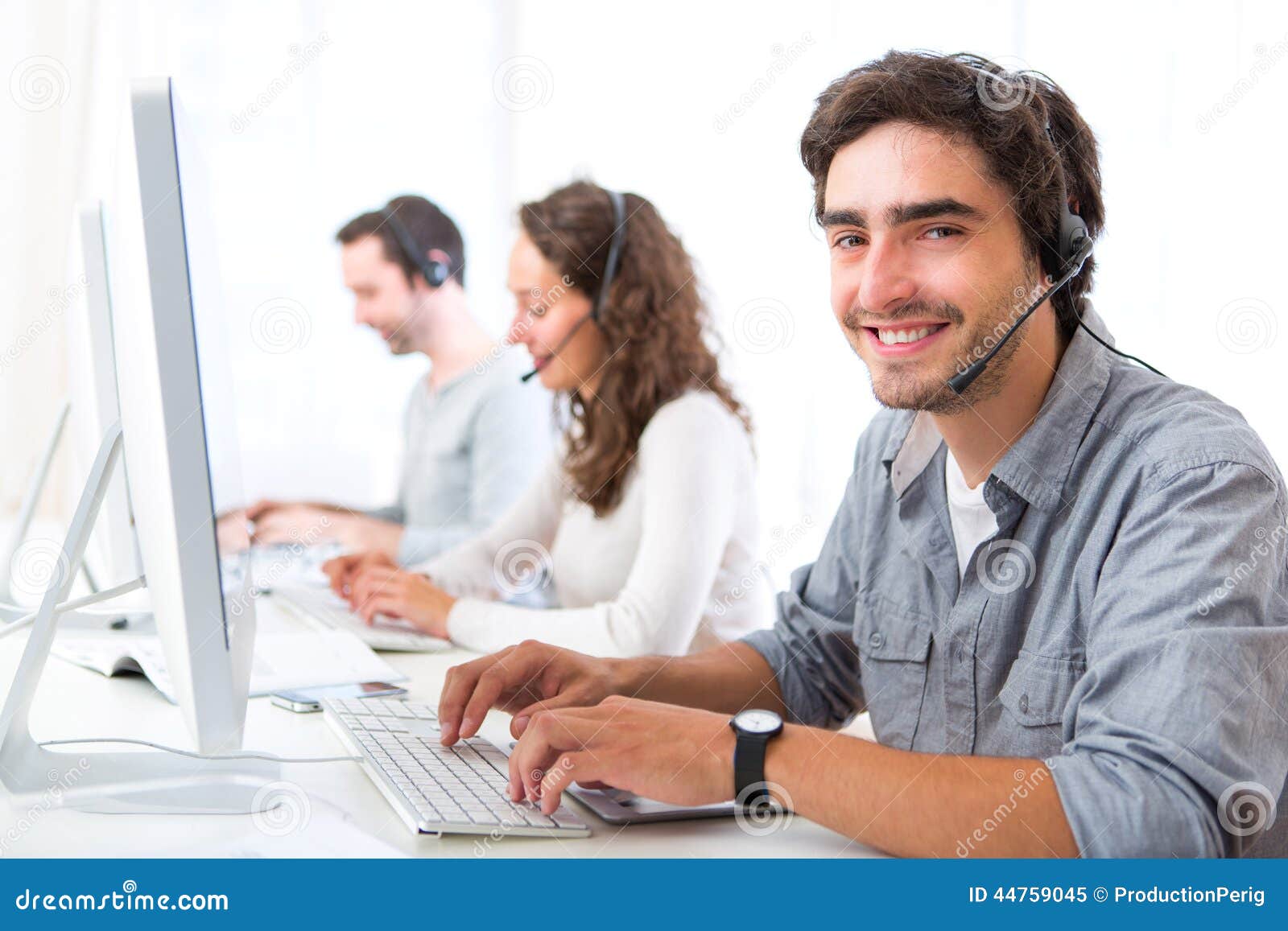 Young Attractive Man Working in a Call Center Stock Image - Image of ...