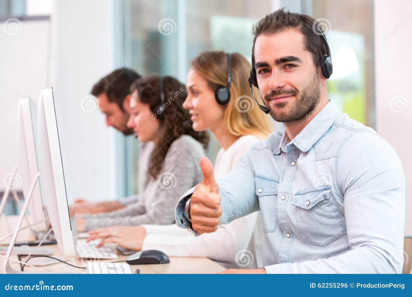 Young Attractive Man Working in a Call Center Stock Photo - Image of ...