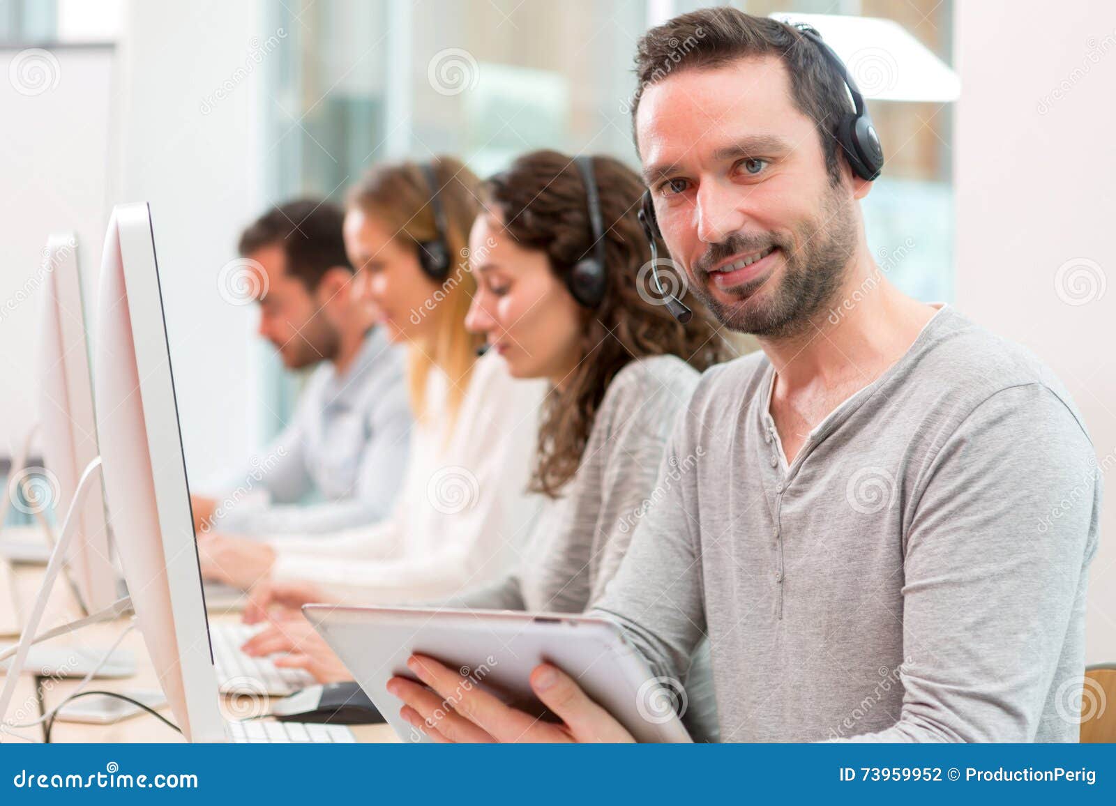 Young Attractive Man Working in a Call Center Stock Photo - Image of ...