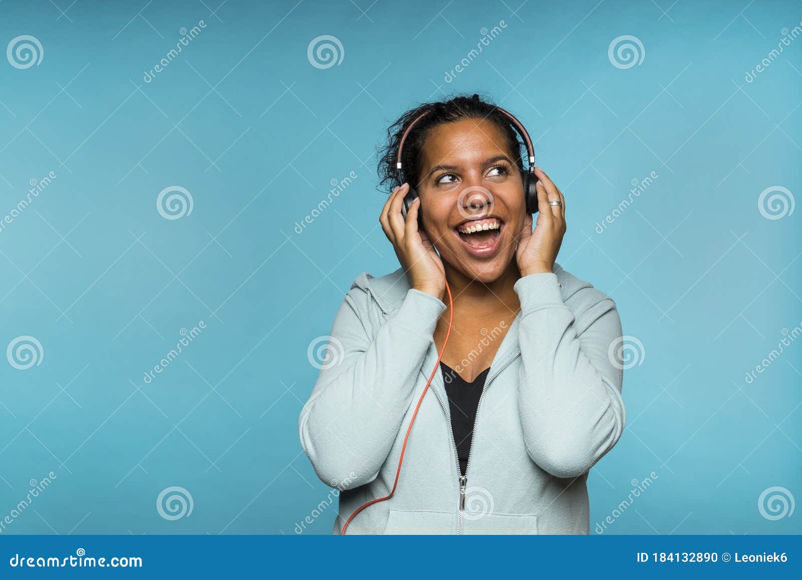 Young Attractive Mixed Race Woman Enjoying Music Listening with ... Young Attractive Mixed Race Woman Enjoying Music Listening with ...