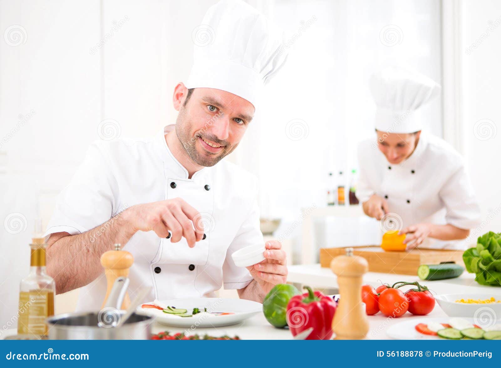 Young Attractive Professional Chef Cooking in His Kitchen Stock Photo ...
