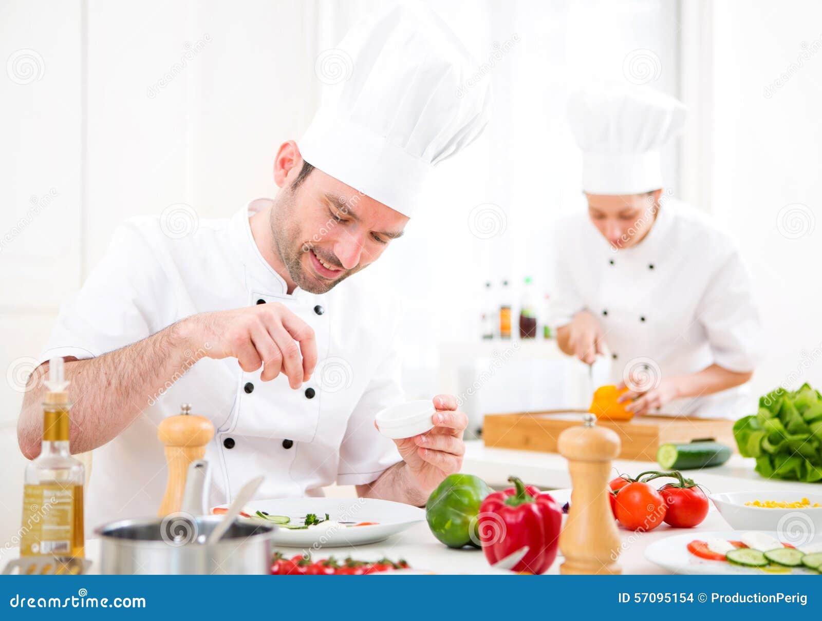 Young Attractive Professional Chef Cooking in His Kitchen Stock Photo ...