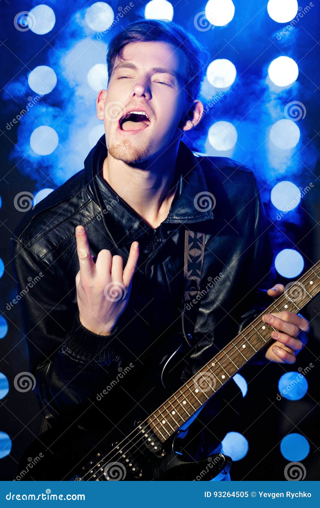 Young Attractive Rock Musician Playing Electric Guitar and Singing ... Young Attractive Rock Musician Playing Electric Guitar and Singing ...