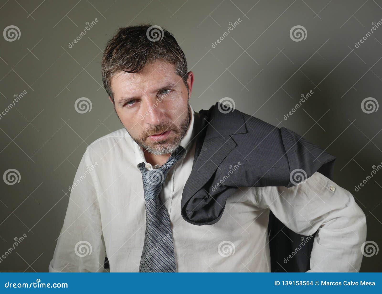 Young Attractive Sad And Worried Businessman In Lose Tie And Messy Look