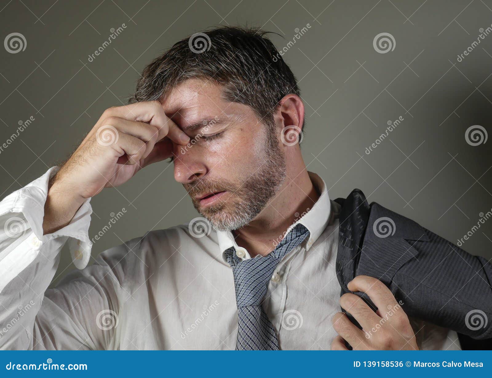 Young Attractive Sad And Worried Businessman In Lose Tie And Messy Look