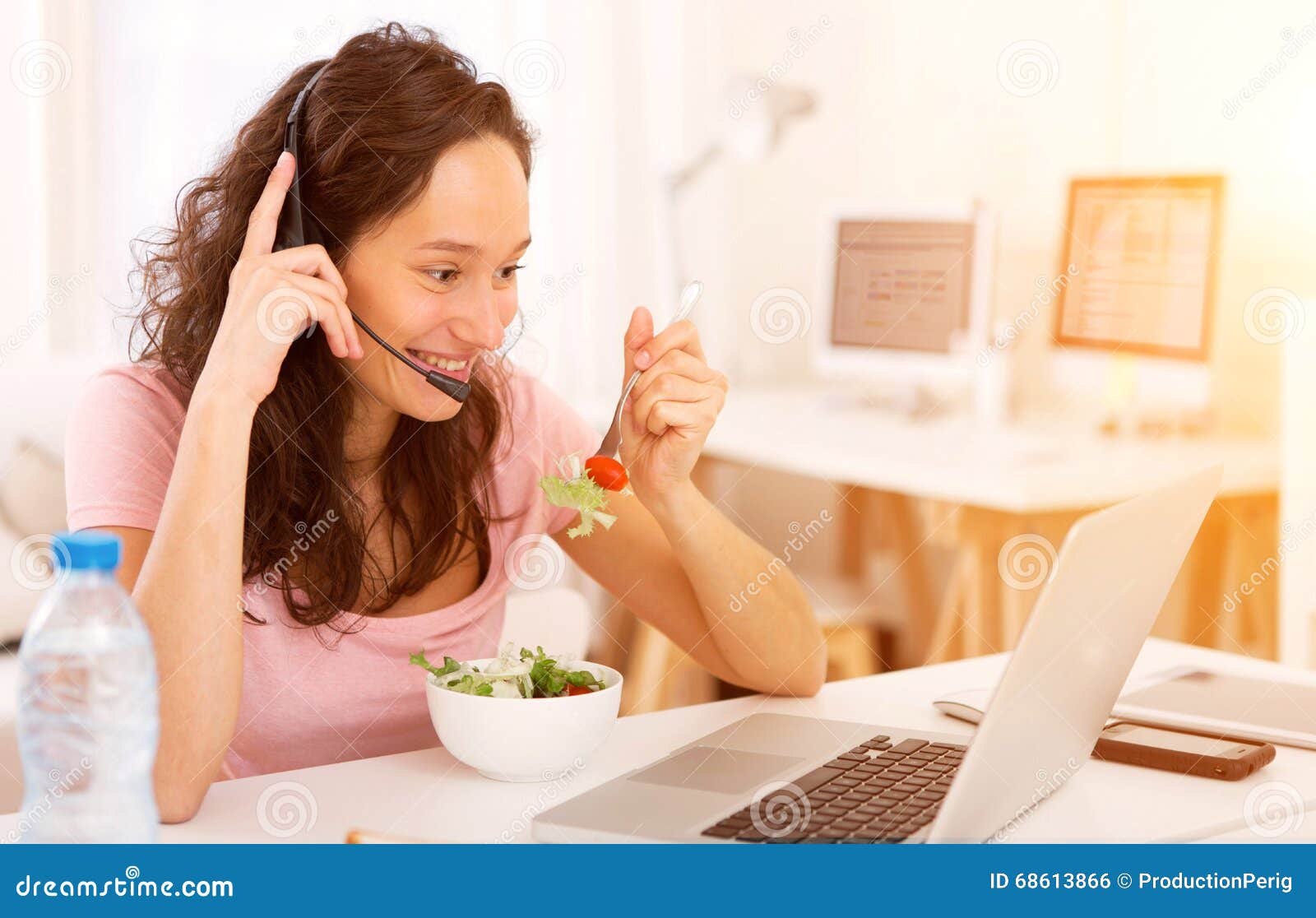 Young Attractive Student Eating while Working Stock Photo - Image of ...
