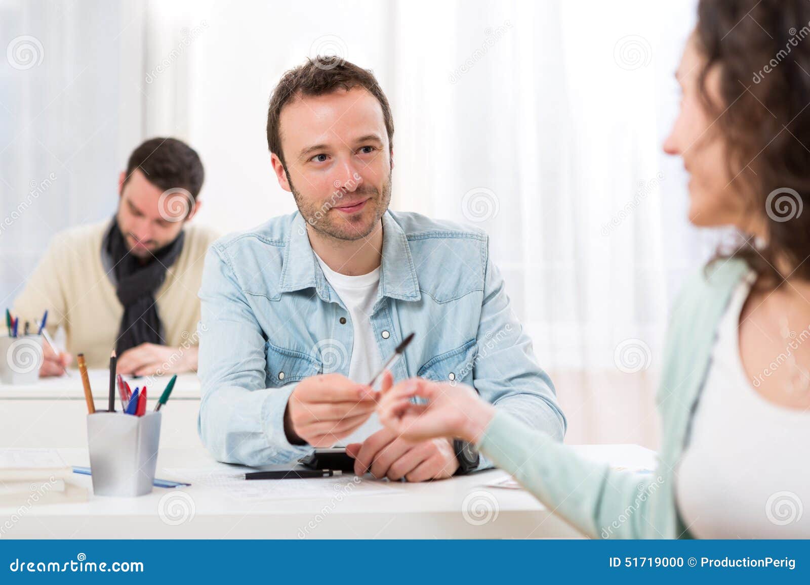 Young Attractive Student Lend a Pen To Classmate Stock Photo - Image of ...