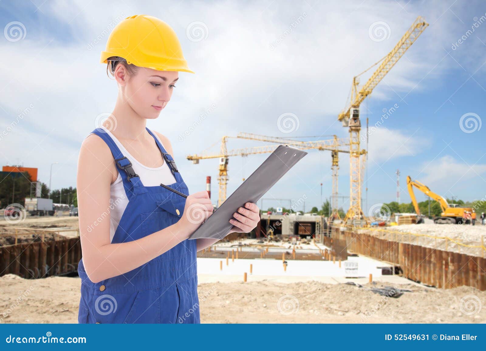 Young Attractive Woman Builder Writing Something in Clipboard Stock ...