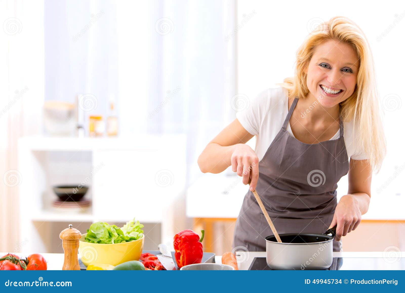 Young Attractive Woman Cooking in a Kitchen Stock Photo - Image of ...