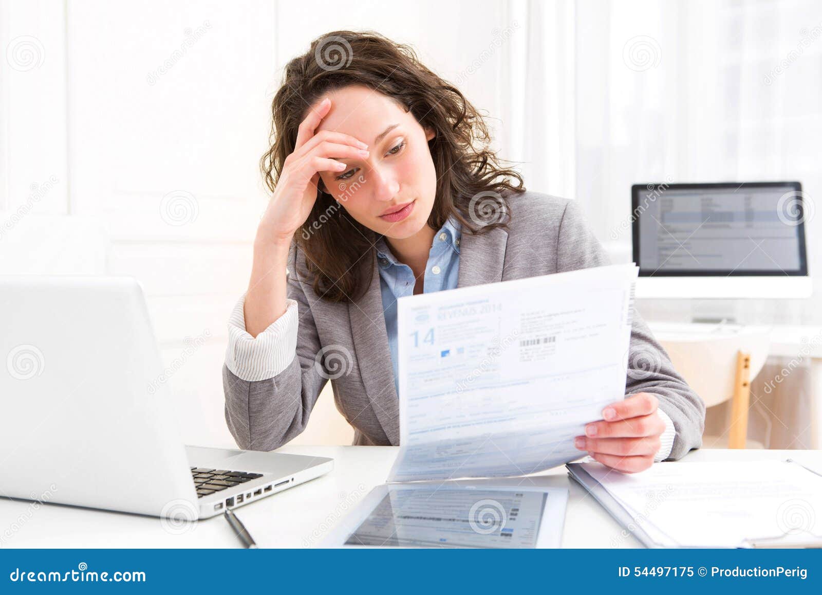 Young Attractive Woman Doing Paperwork Stock Image - Image of computer ...