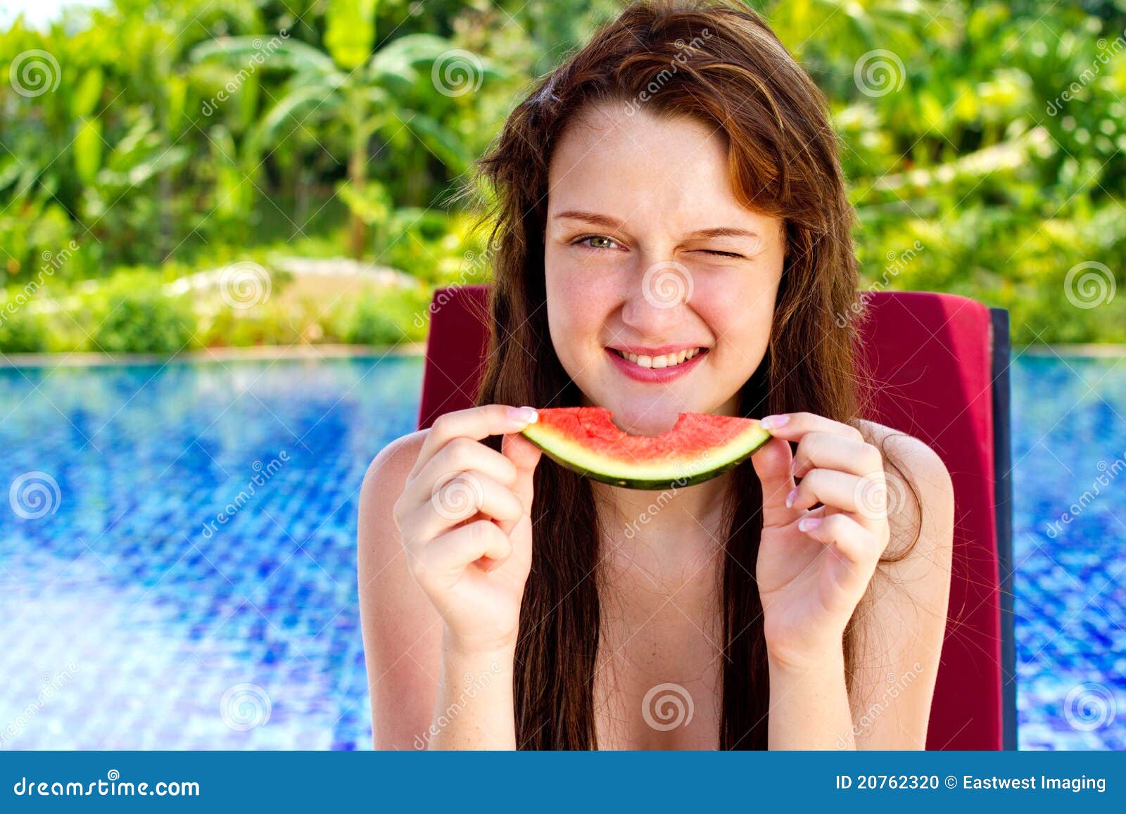 An Young and Attractive Woman Eating Watermelon by Stock Photo - Image ...