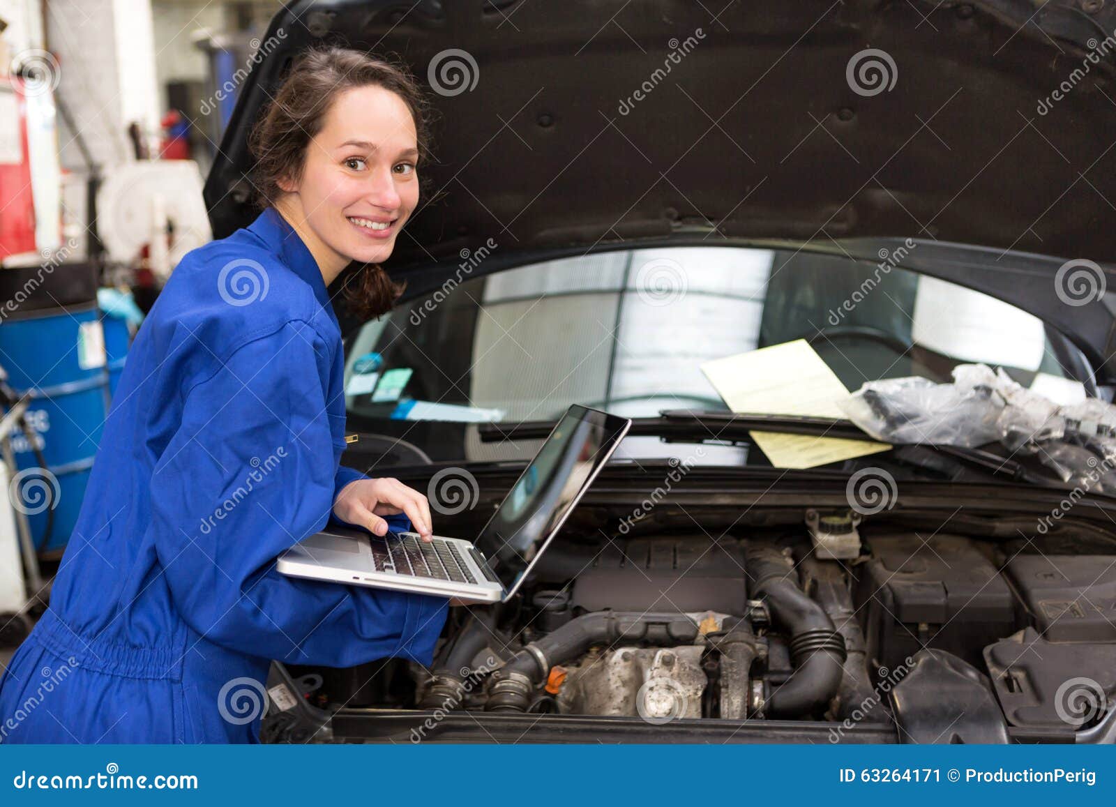 Young Attractive Woman Mechanic Working at the Garage Stock Image ...