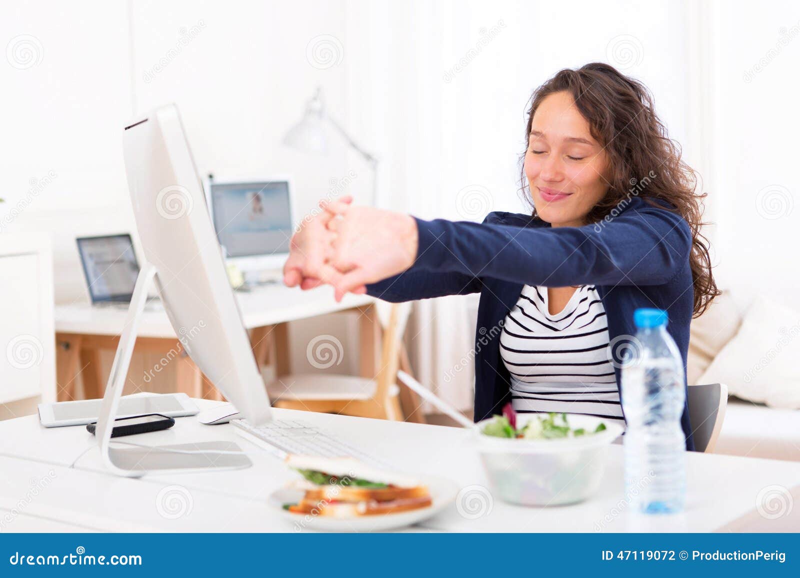 Young Attractive Woman Stretching during a Break Stock Photo - Image of ...