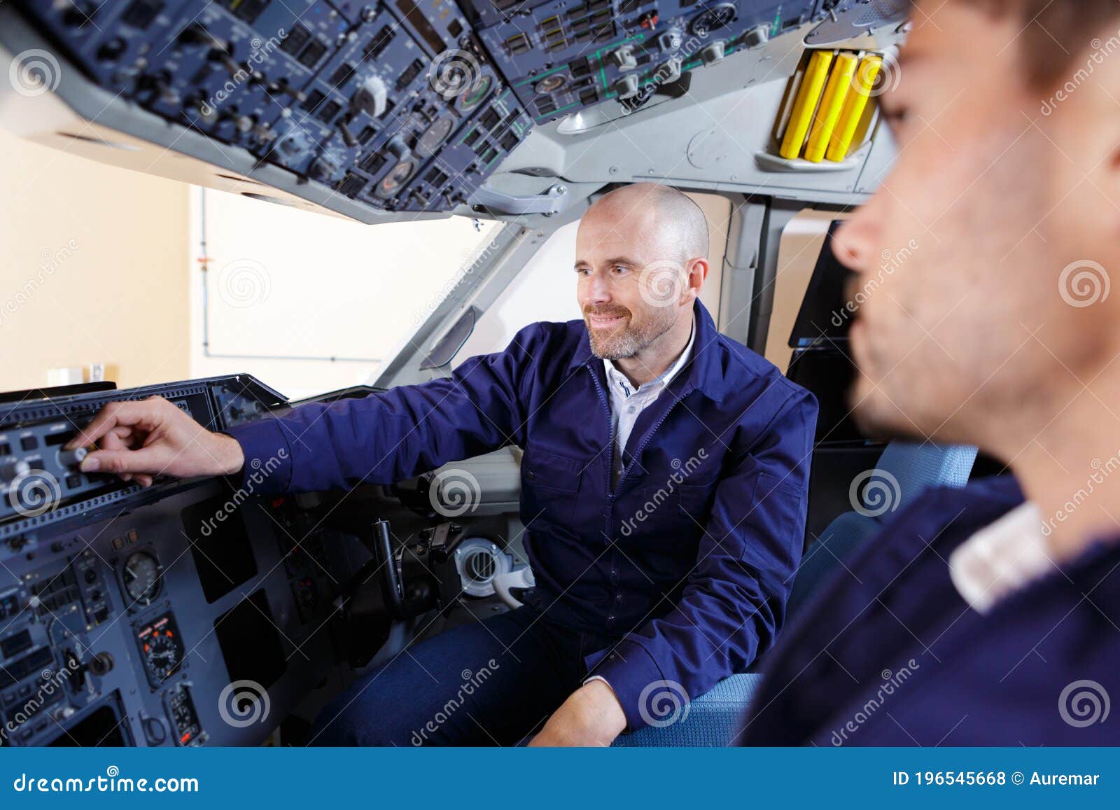 Young Aviation Technician in Cockpit with Trainer Stock Photo - Image ...