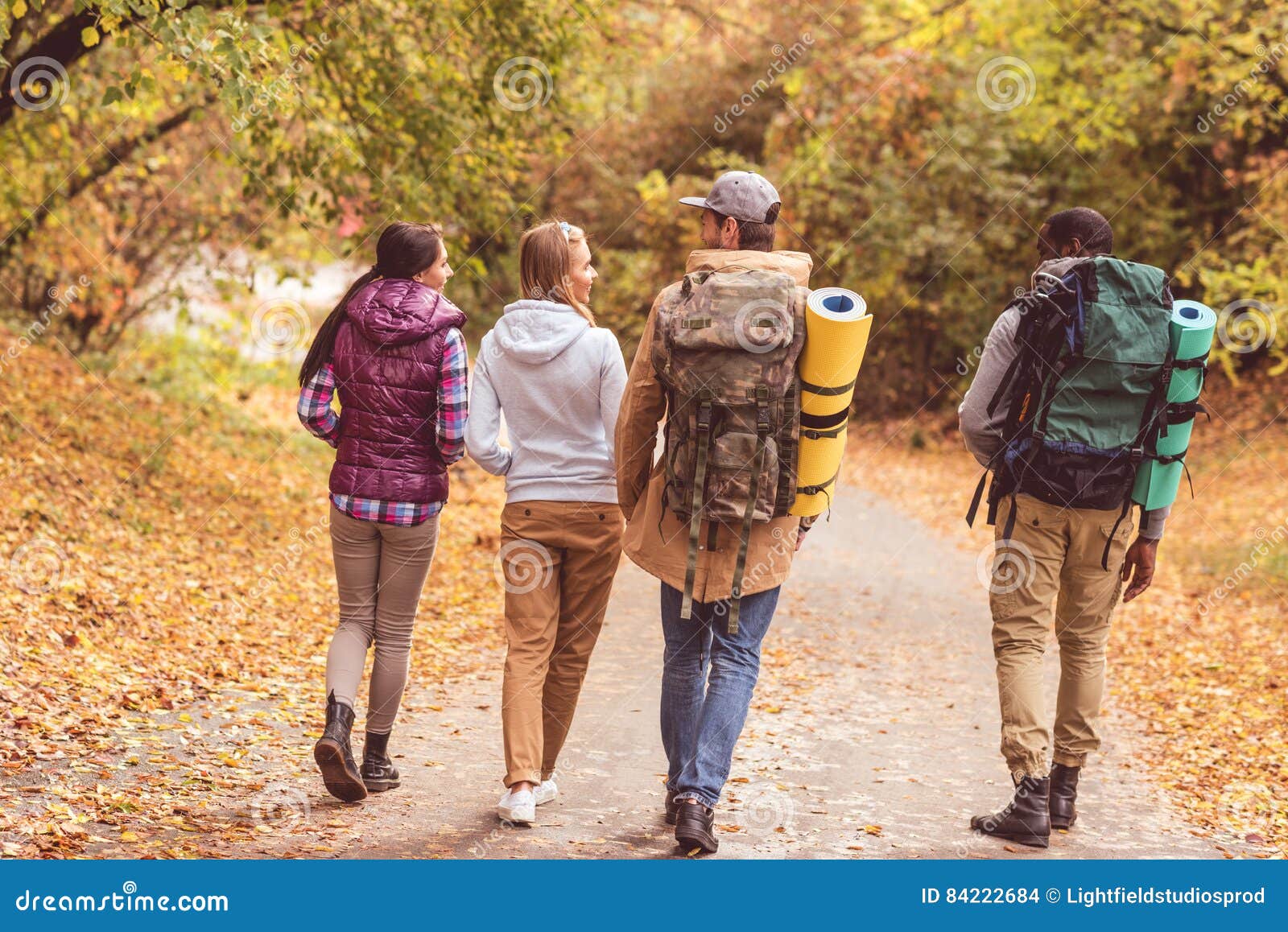 Young Backpackers in Autumn Forest Stock Photo - Image of lifestyle ...