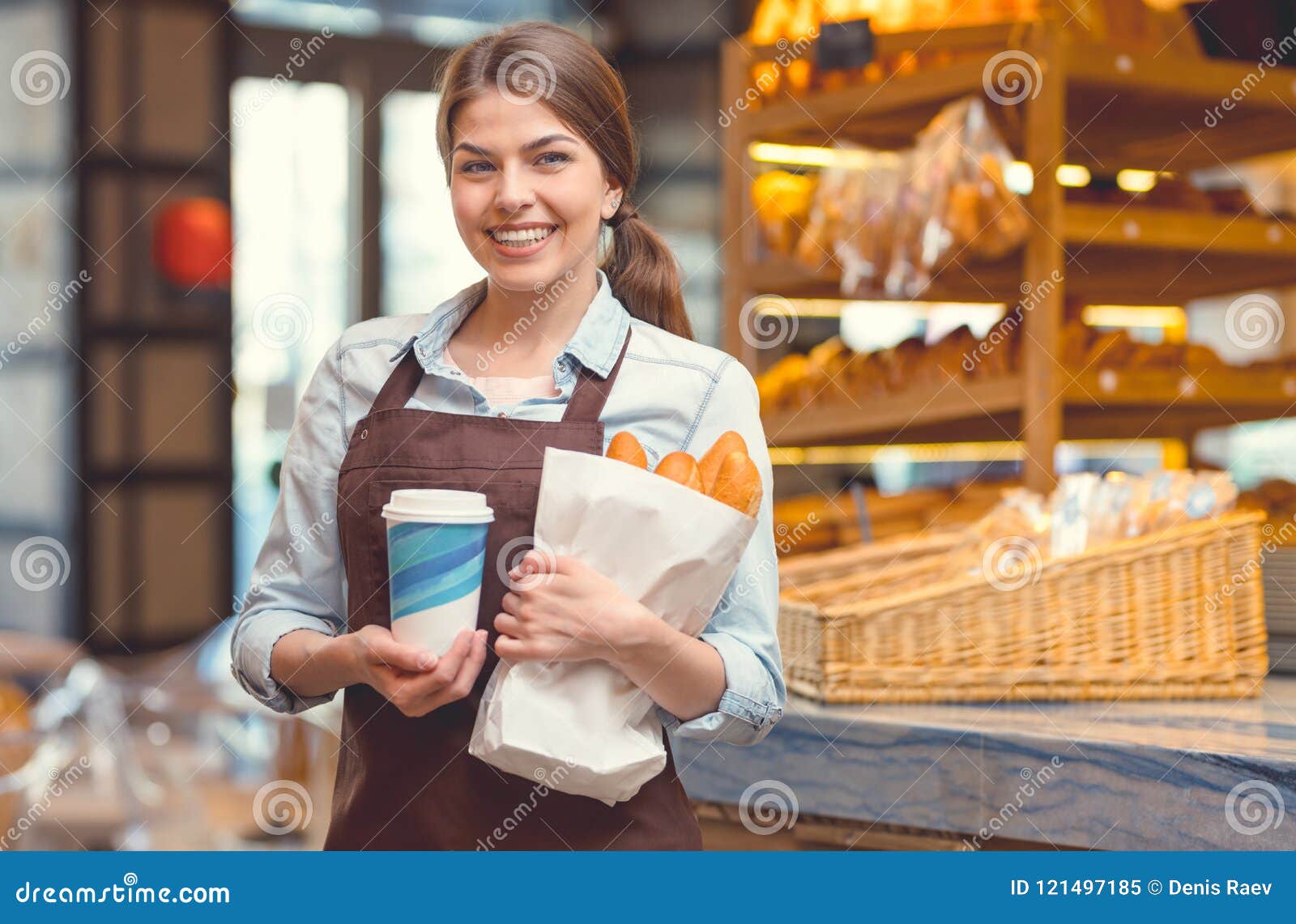 Young baker in the bakery stock image. Image of brown - 121497185