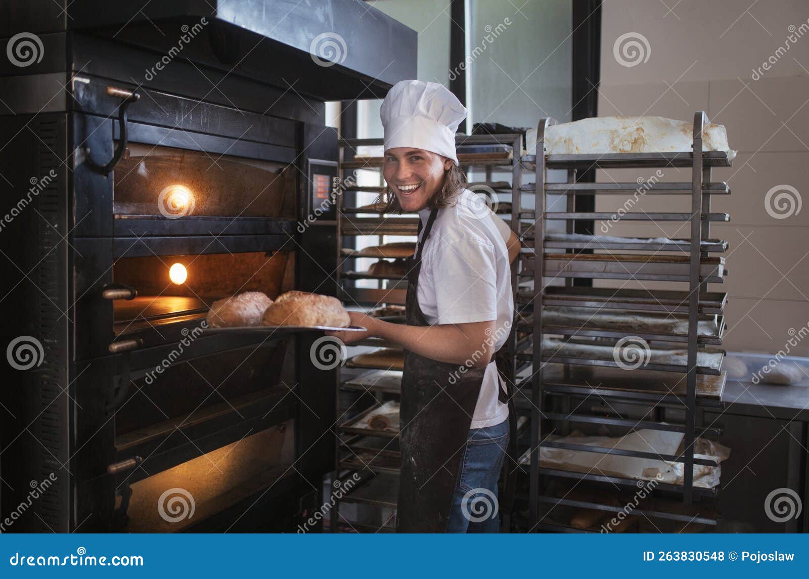 Young Baker with Chef Cap Preparing Pastries in Bakery. Stock Photo ...