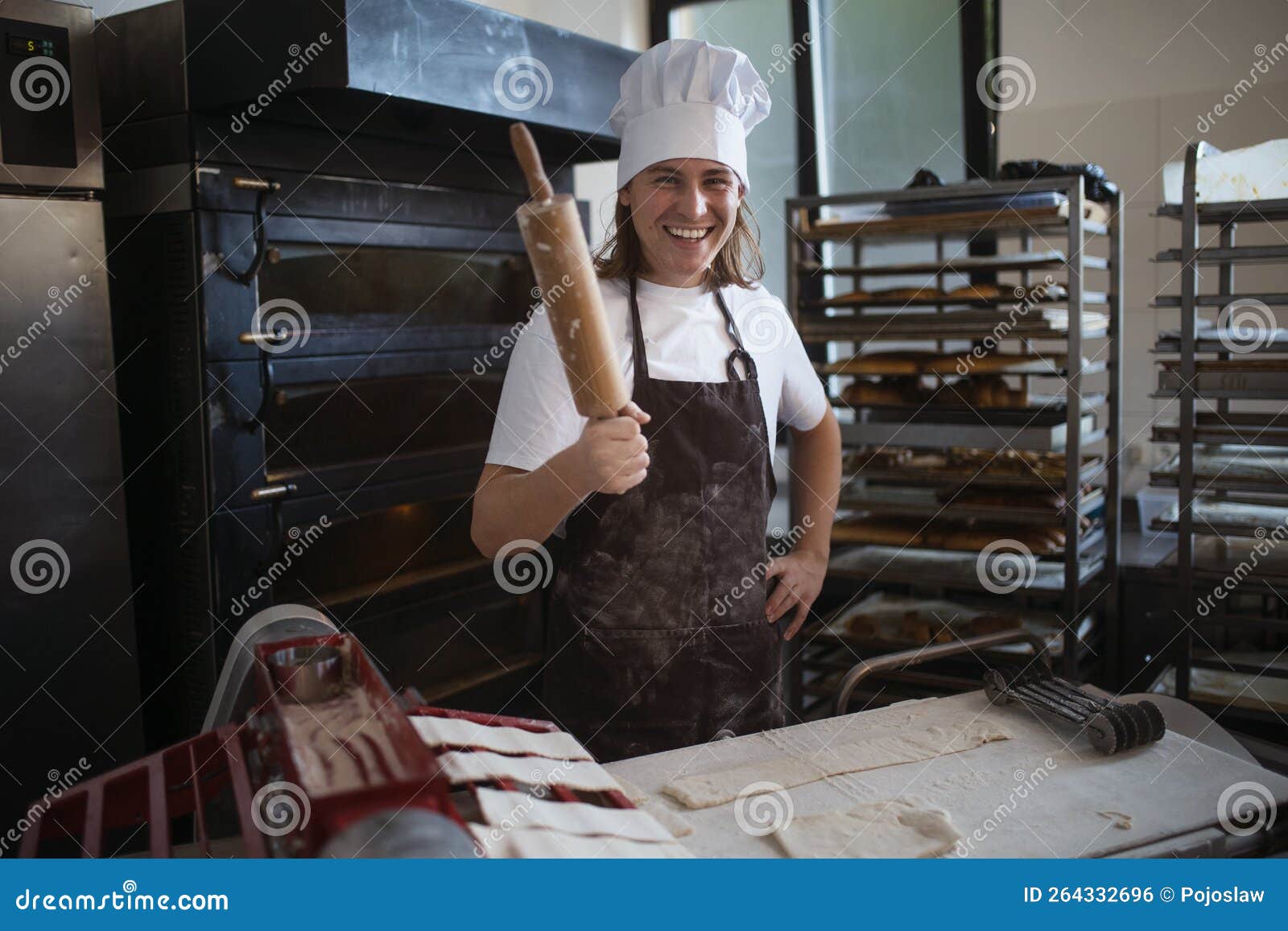 Young Baker with Chef Cap Preparing Pastries in Bakery. Stock Photo ...