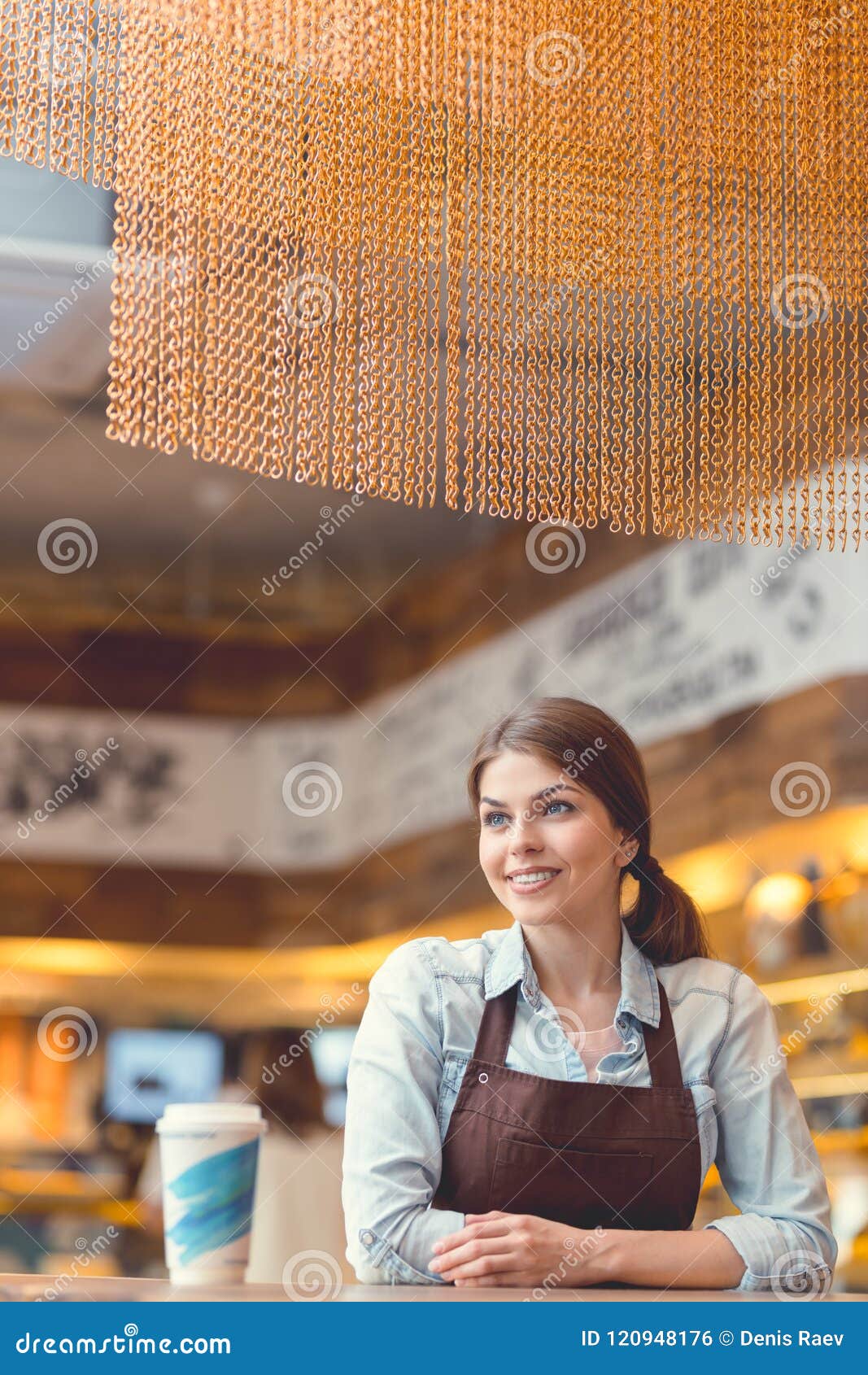 Young baker with coffee stock photo. Image of apron - 120948176