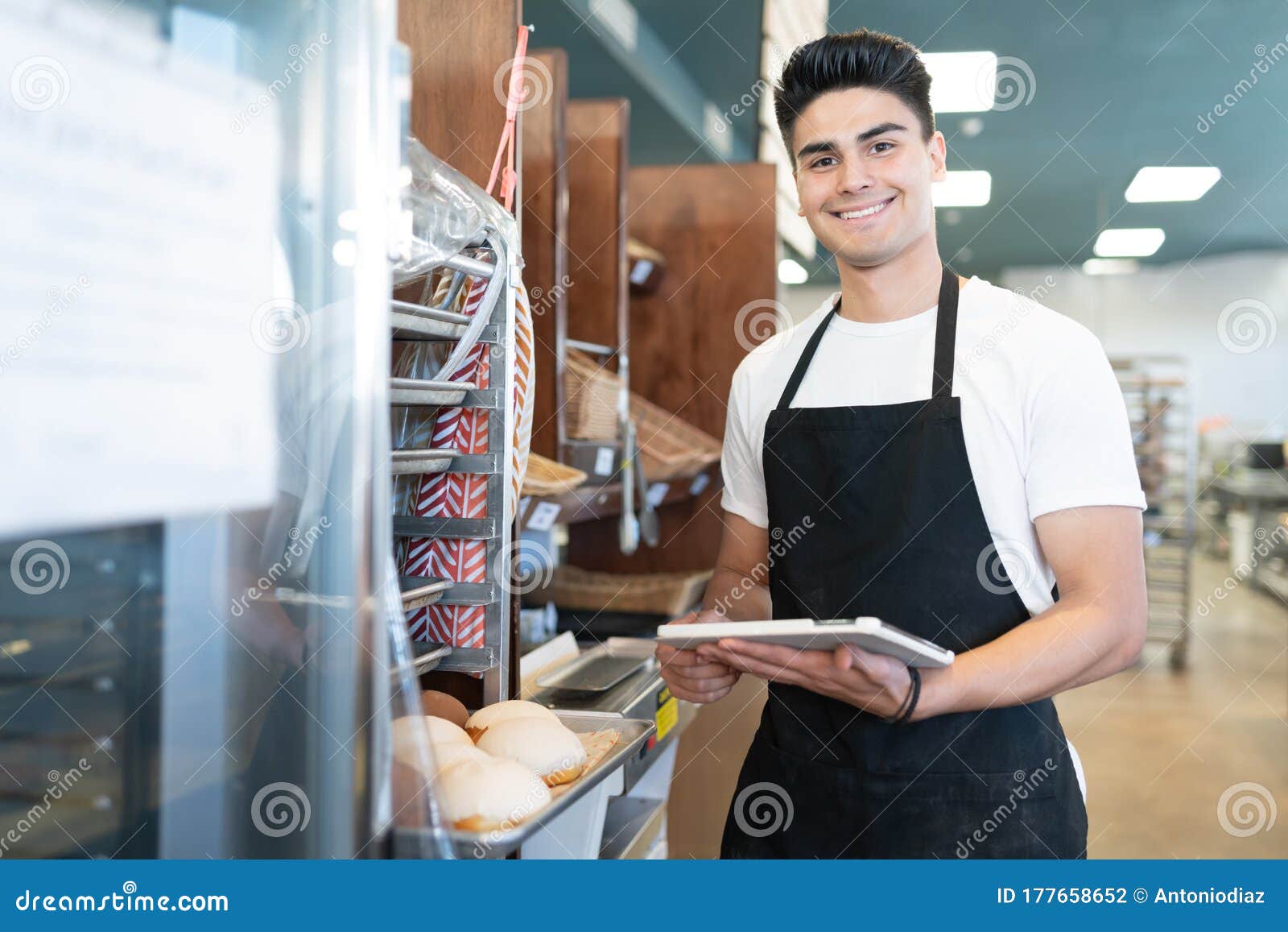 Young Baker Counting Bread in a Bakery Stock Photo - Image of kitchen ...