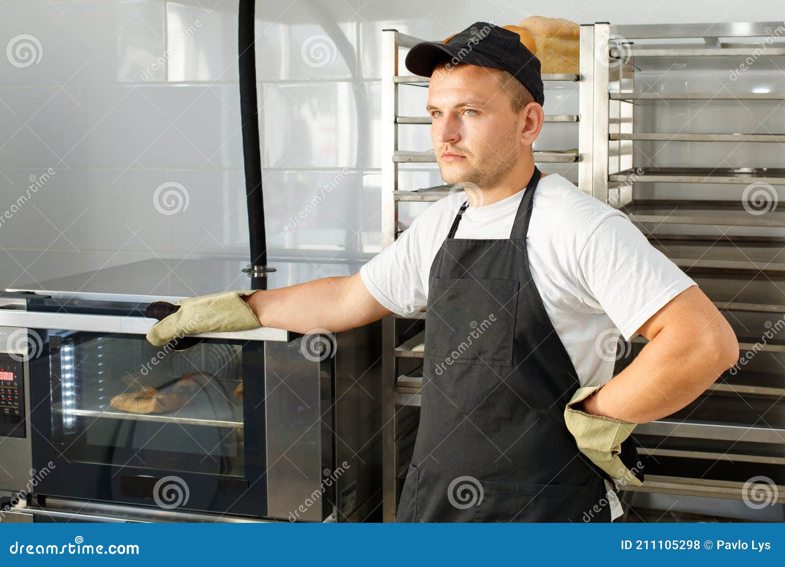 Young Baker Worker in a Bakery in Uniform Stock Photo - Image of ...