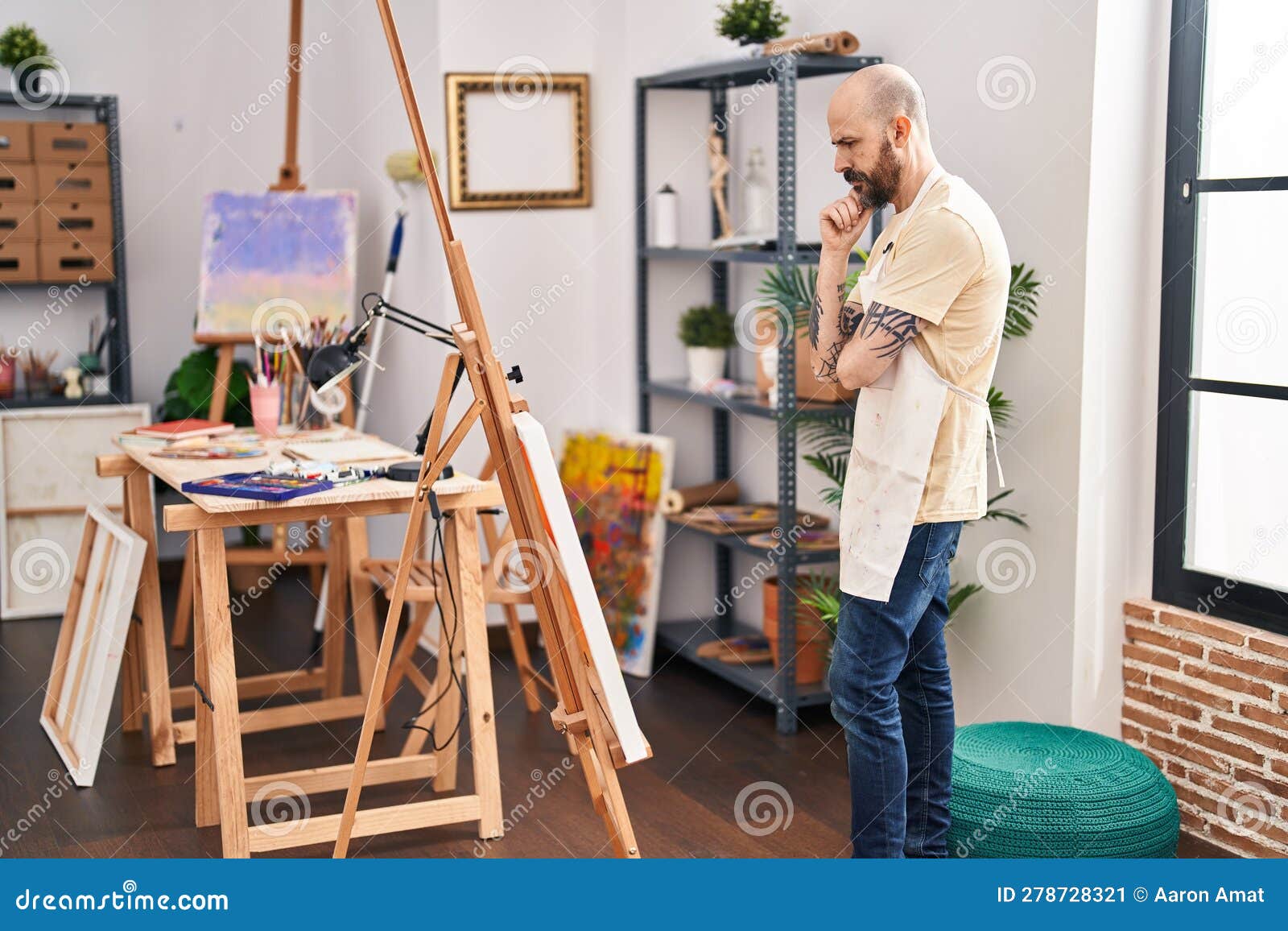 Young Bald Man Artist Looking Draw with Serious Expression at Art ...