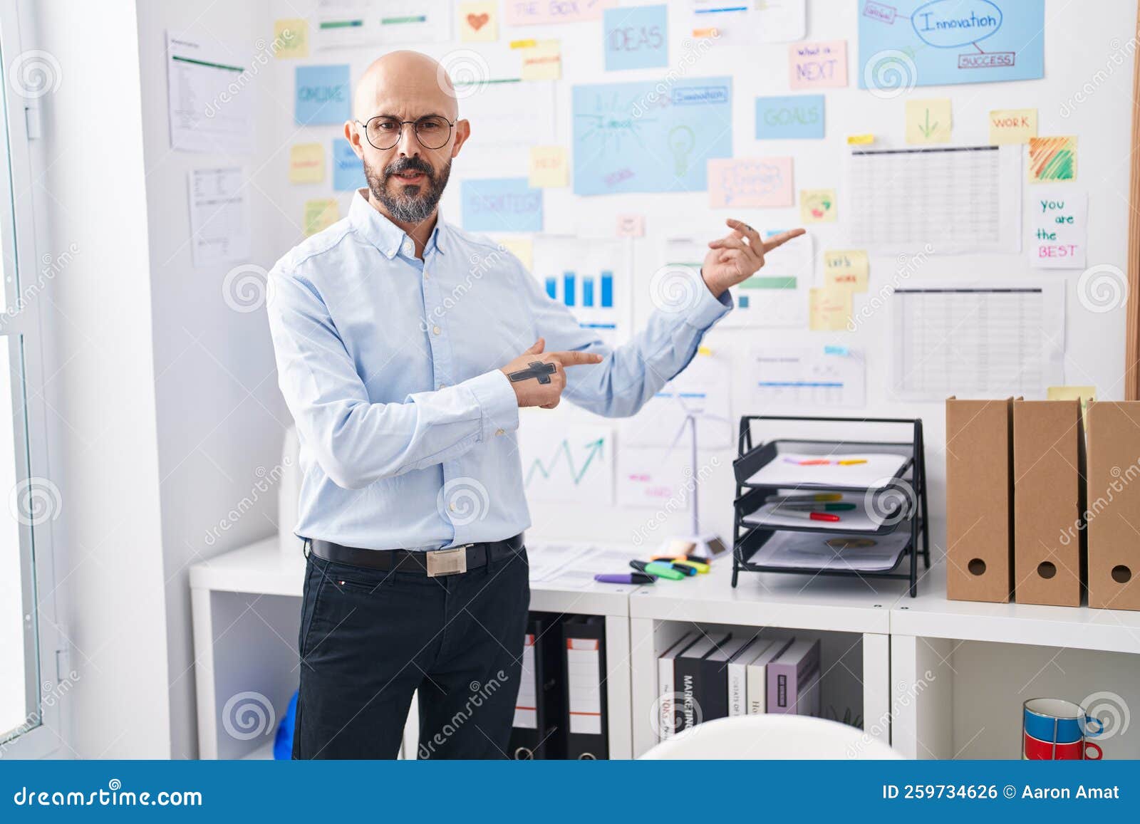 Young Bald Man Business Worker Speaking at Office Stock Photo - Image ...