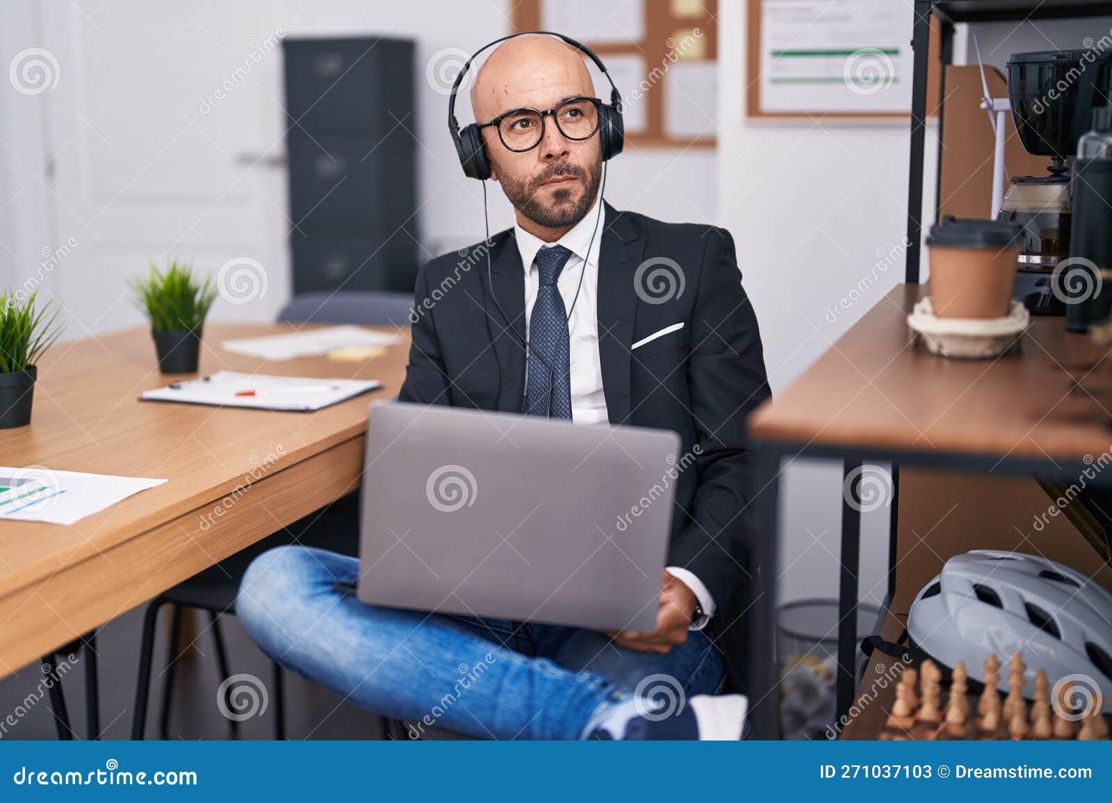 Young Bald Man Business Worker Using Laptop and Headphones Working at ...