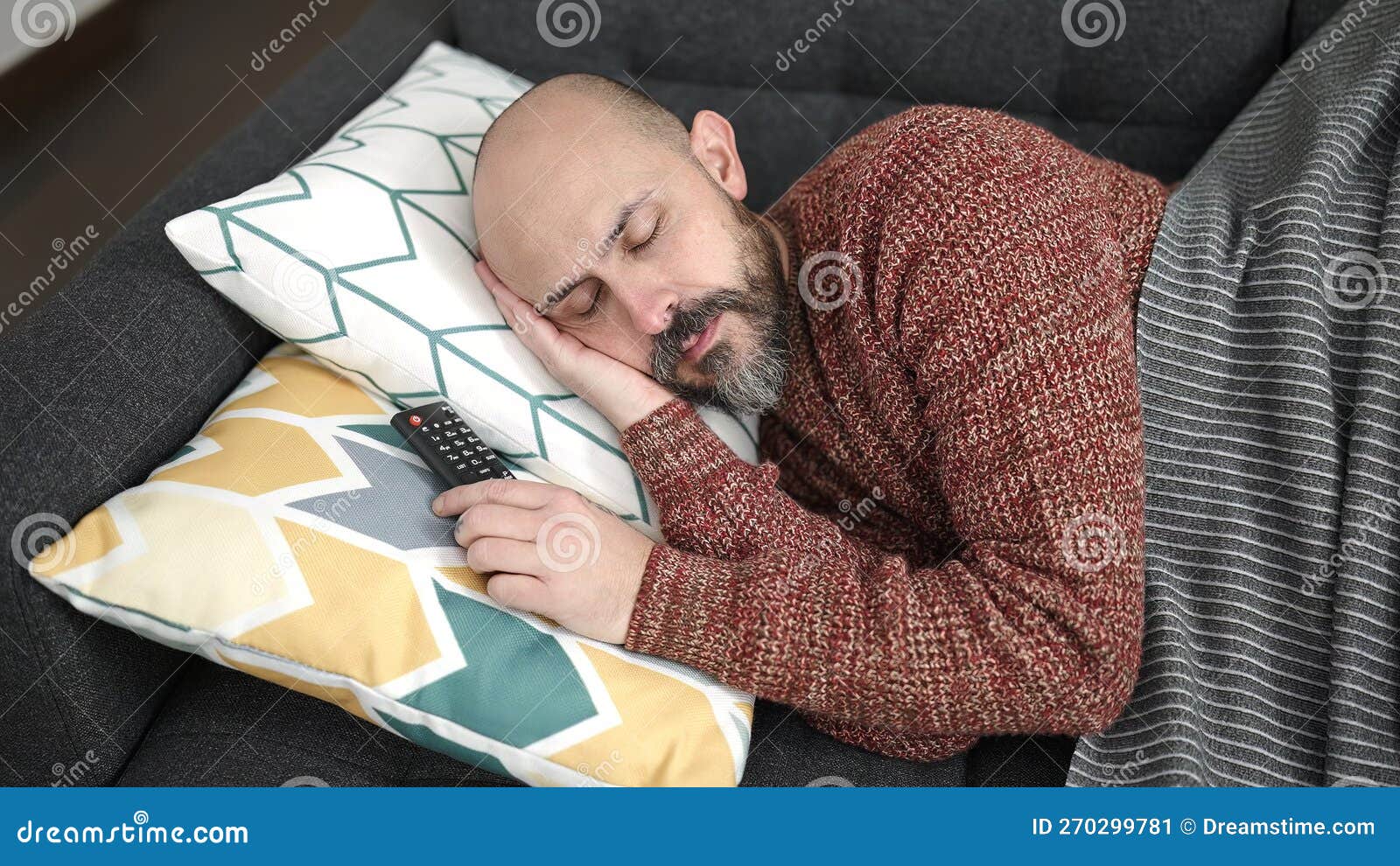 Young Bald Man Holding Tv Remote Control Lying on Sofa Sleeping at Home ...