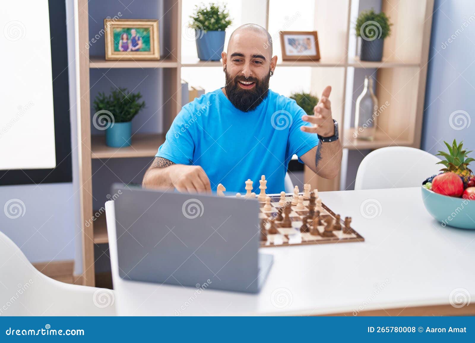 Young Bald Man Playing Online Chess Game Sitting on Table at Home Stock ...