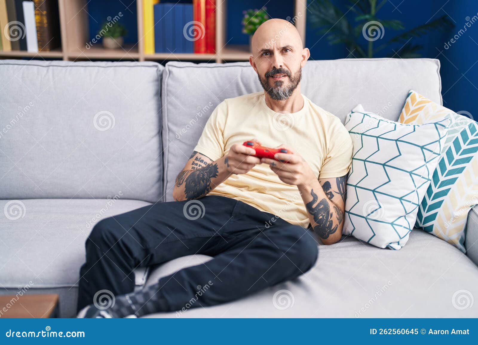 Young Bald Man Playing Video Game Sitting on Sofa at Home Stock Image ...