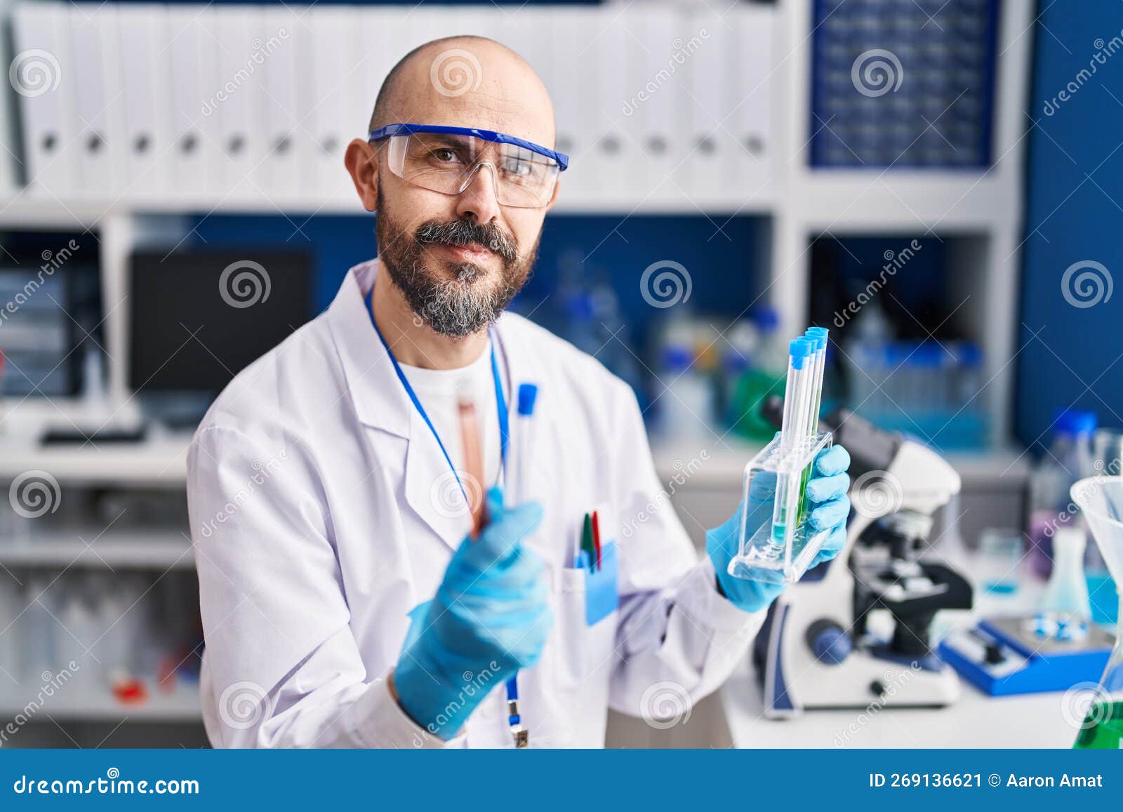 Young Bald Man Scientist Holding Test Tubes at Laboratory Stock Image ... Young Bald Man Scientist Holding Test Tubes at Laboratory Stock Image ...