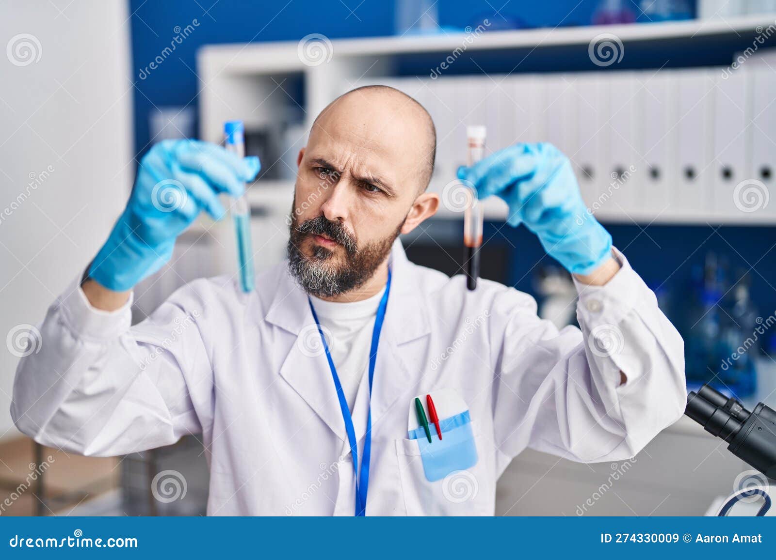 Young Bald Man Scientist Holding Test Tubes at Laboratory Stock Image ... Young Bald Man Scientist Holding Test Tubes at Laboratory Stock Image ...