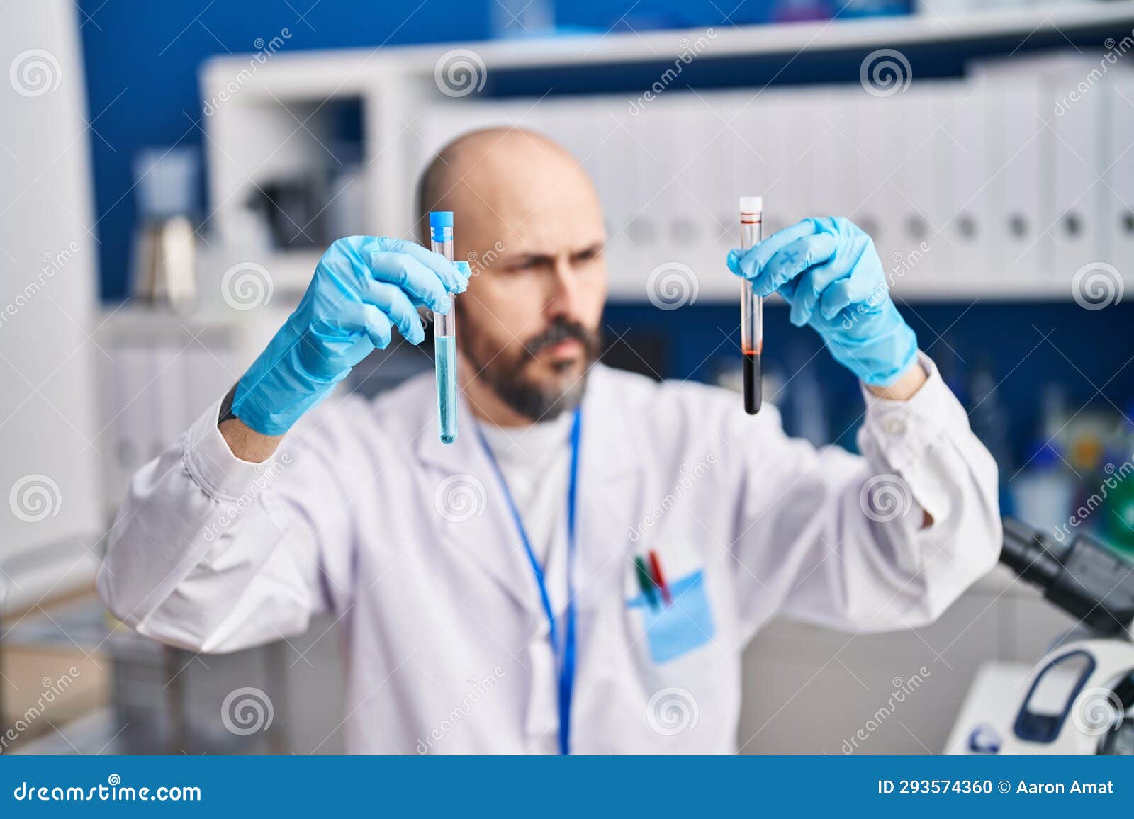 Young Bald Man Scientist Holding Test Tubes at Laboratory Stock Photo ... Young Bald Man Scientist Holding Test Tubes at Laboratory Stock Photo ...