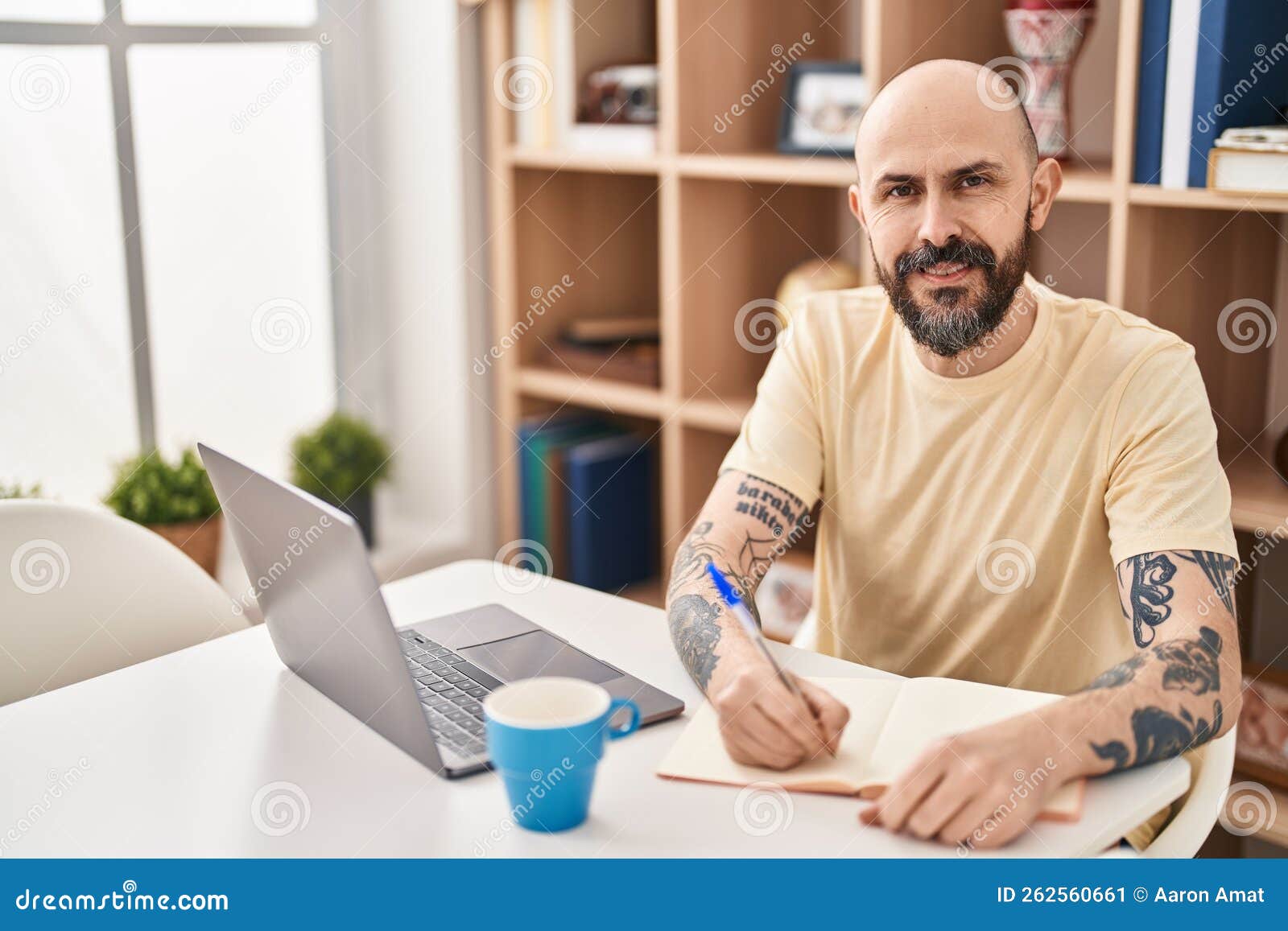Young Bald Man Sitting on Table Studying at Home Stock Image - Image of ...
