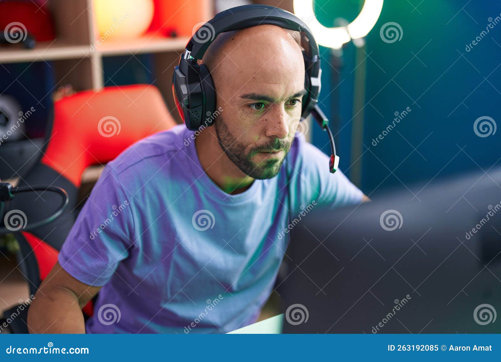 Young Bald Man Streamer Playing Video Game Using Computer at Gaming ...