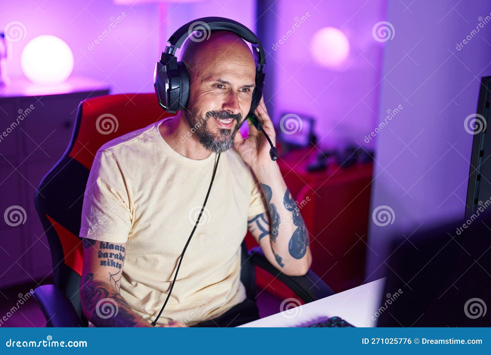 Young Bald Man Streamer Playing Video Game Using Computer at Gaming ...