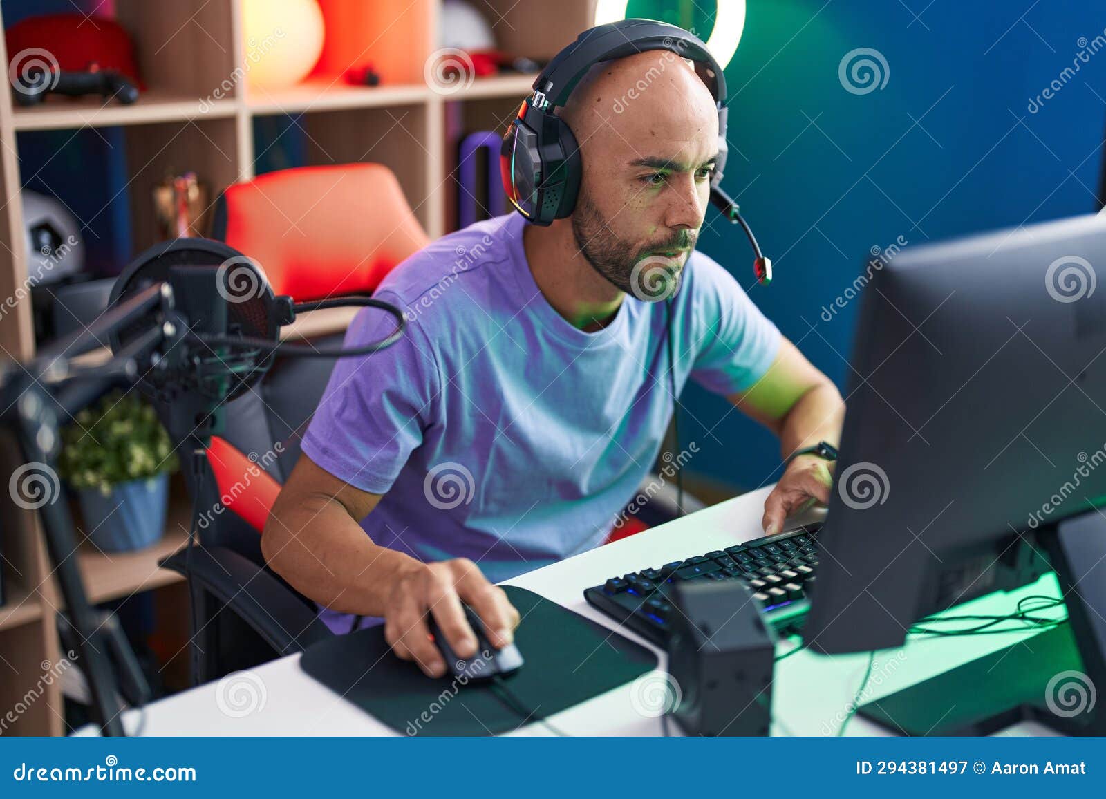 Young Bald Man Streamer Playing Video Game Using Computer at Gaming ...