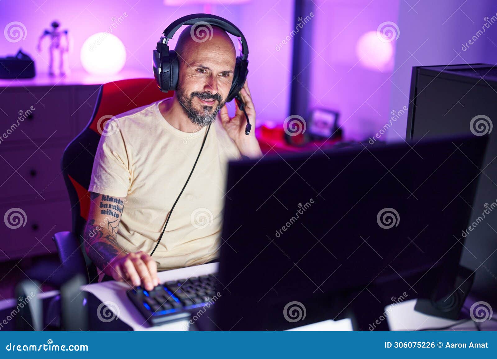 Young Bald Man Streamer Playing Video Game Using Computer at Gaming ...