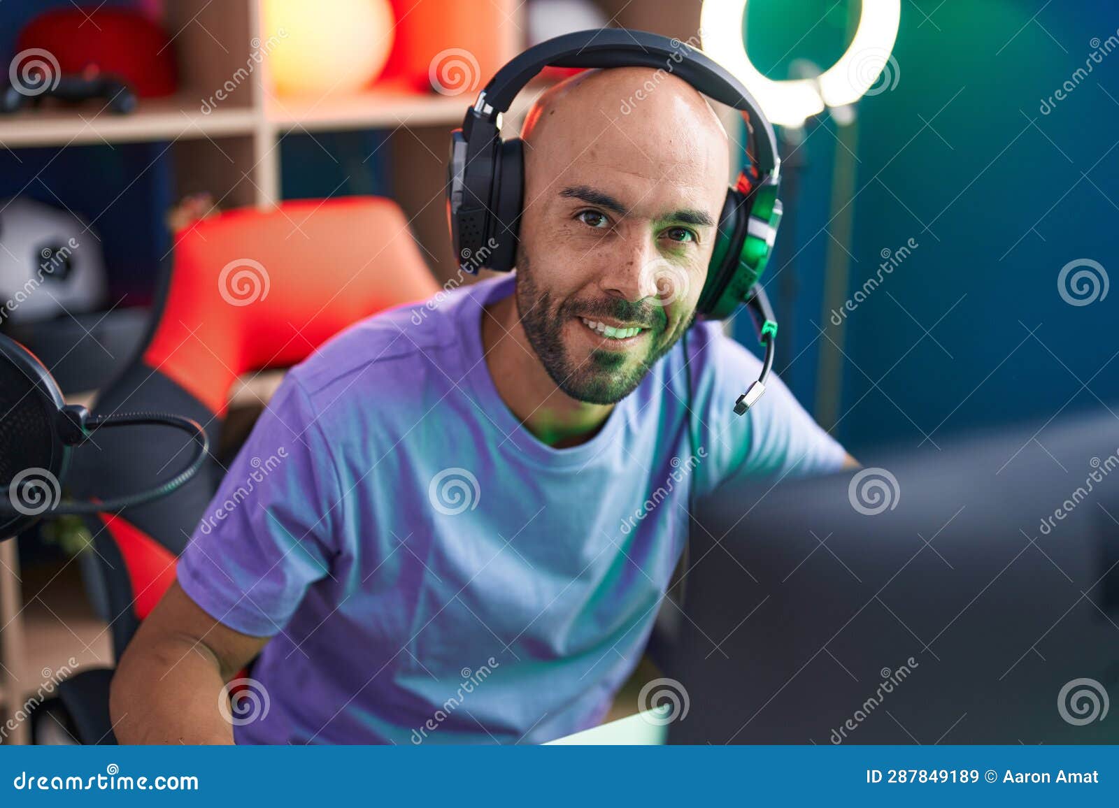 Young Bald Man Streamer Playing Video Game Using Computer at Gaming ...
