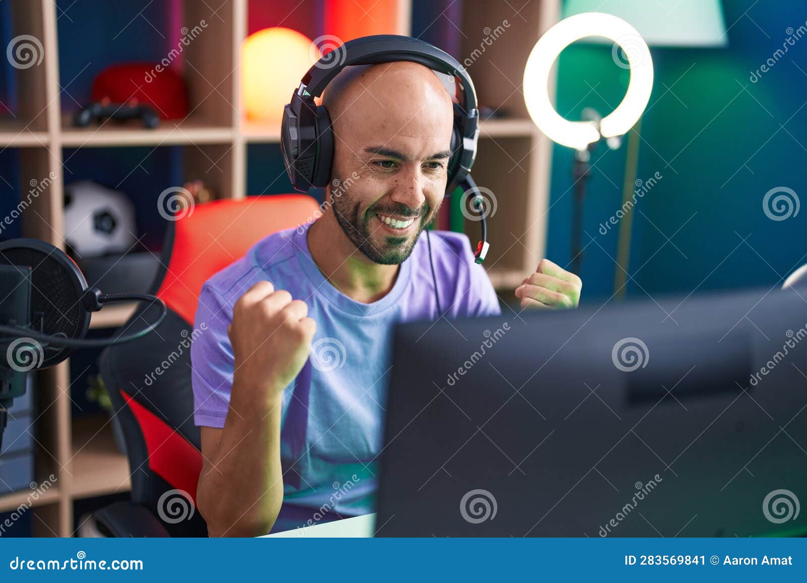 Young Bald Man Streamer Playing Video Game with Winner Expression at ...