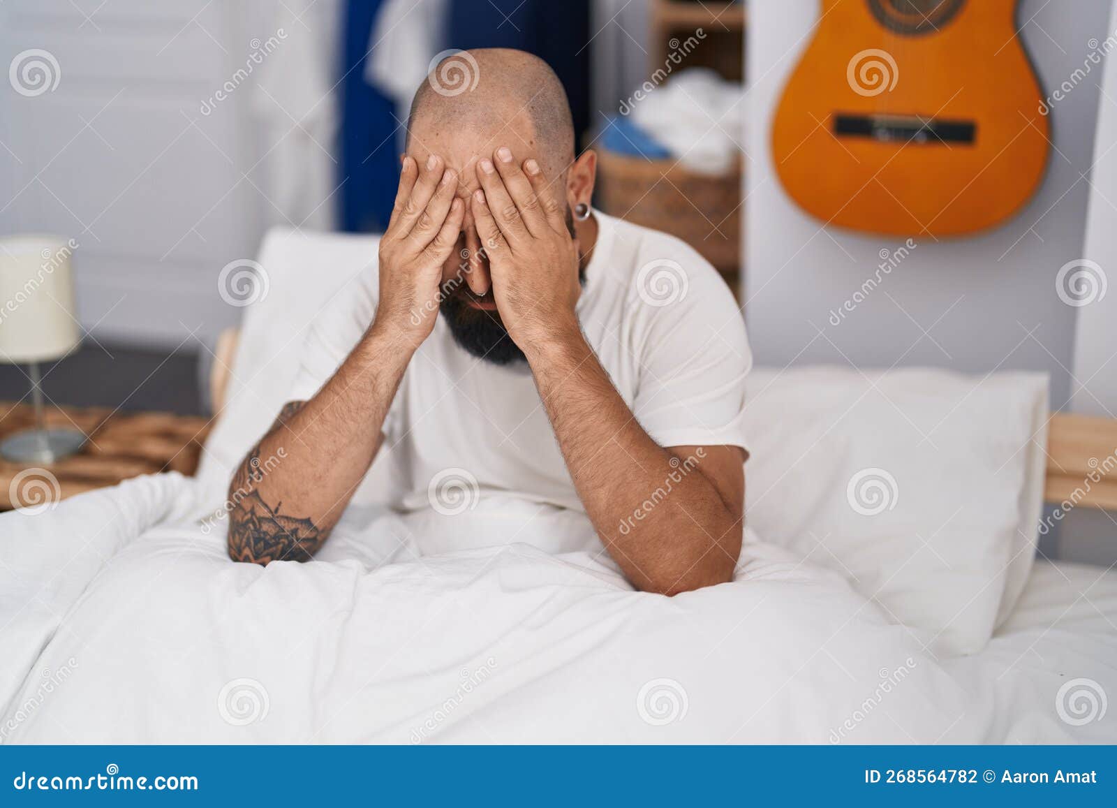 Young Bald Man Stressed Sitting on Bed at Bedroom Stock Photo - Image ...